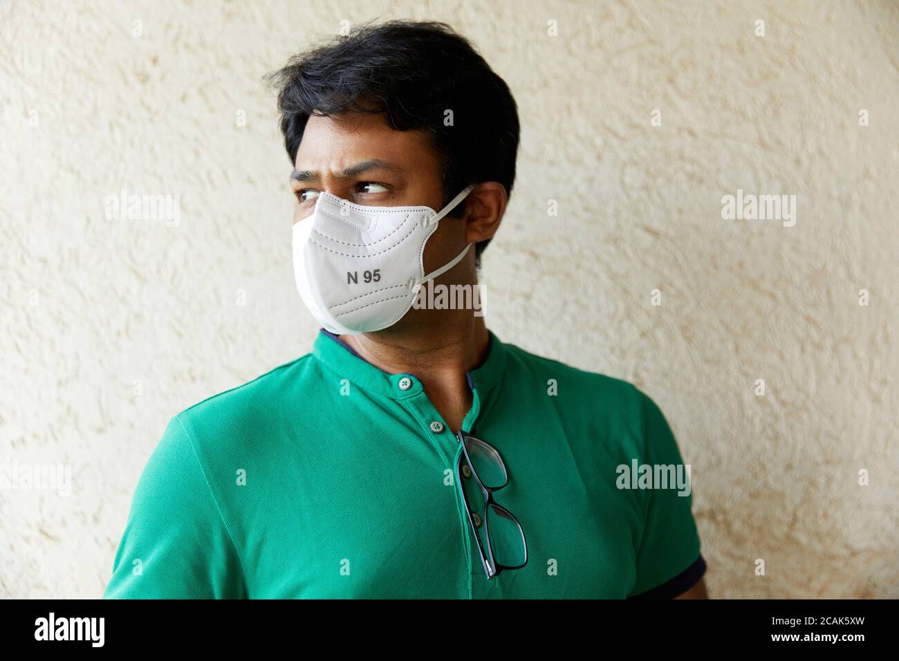 Well Built South Asian Indian Man wearing N95 Respirator Mask. In Green ...