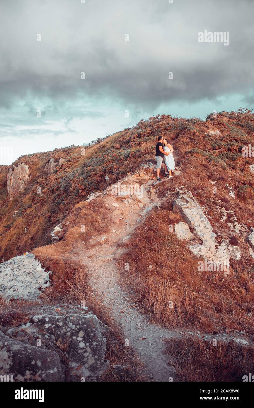 Couple kissing on the edge of a cliff in Loiba, Galicia Stock Photo - Alamy