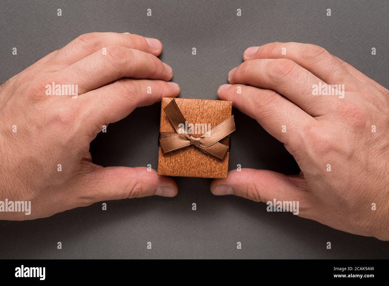 Hands holding open white jewelry box hi-res stock photography and ...