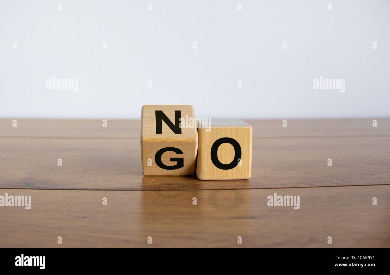 Fliped cube, changes the word NO to GO. Beautiful white background ...