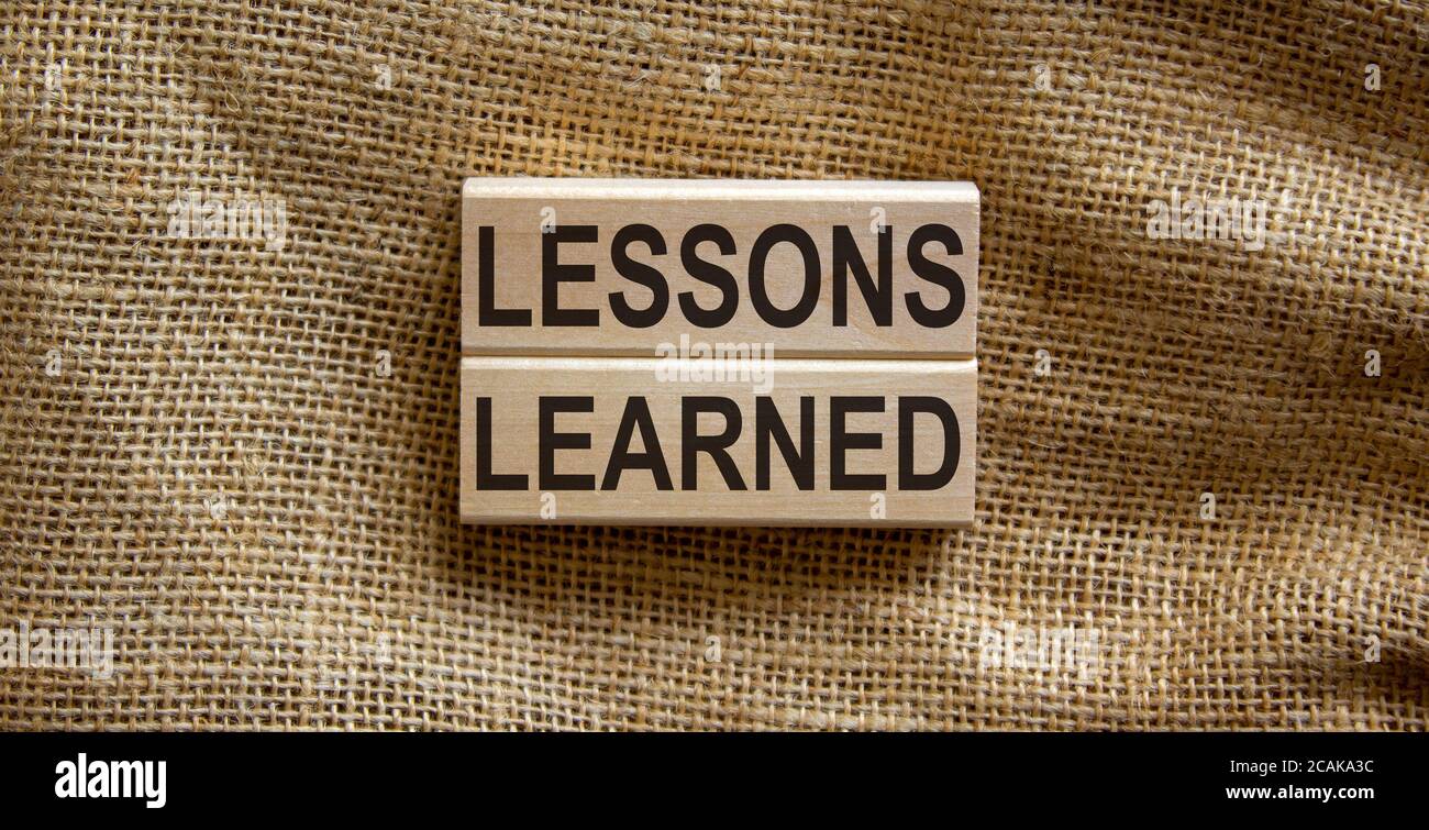 Wooden blocks form the text 'lessons learned' on beautiful canvas ...