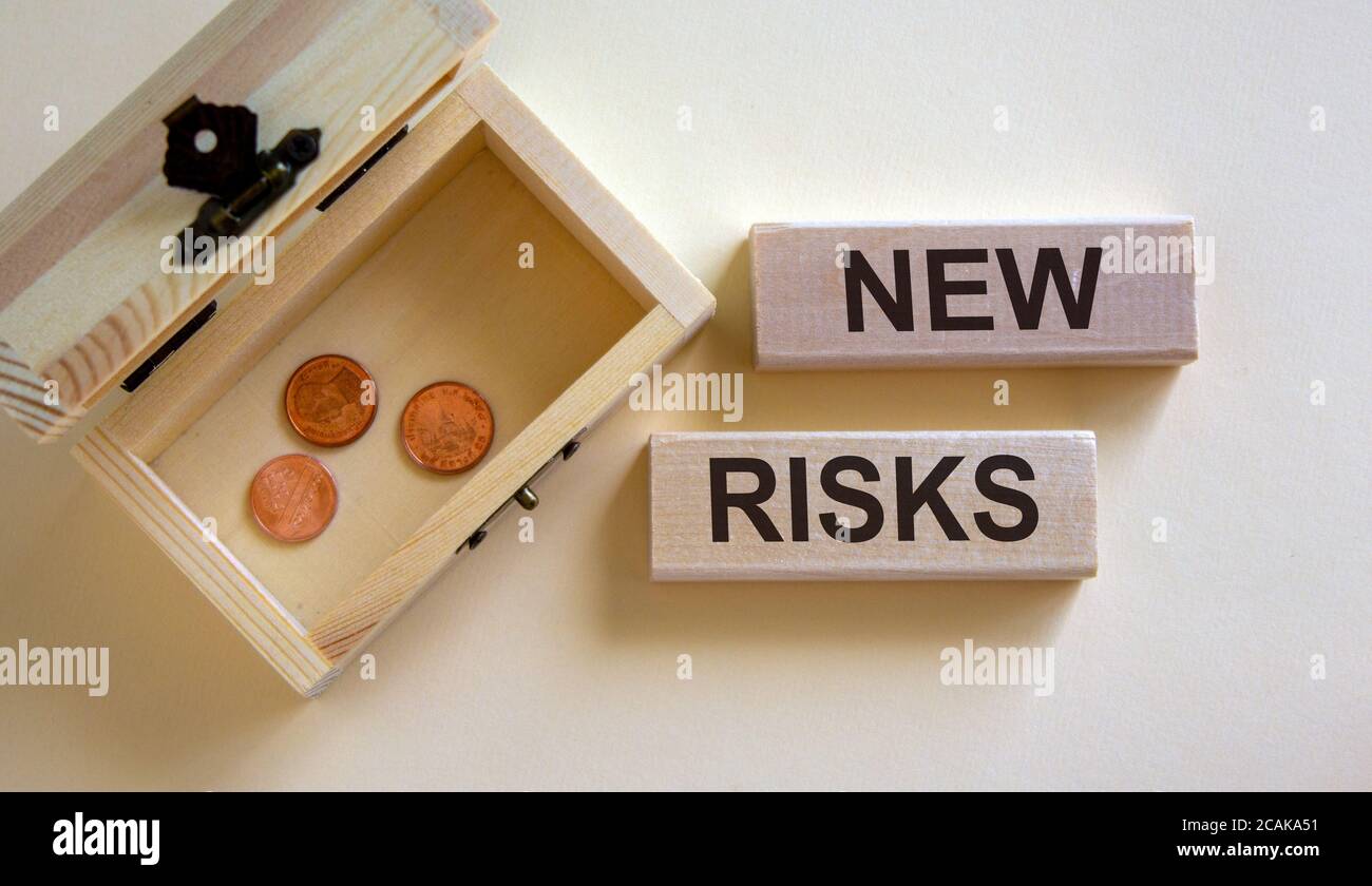 Concept words 'new risks' on blocks on a beautiful white background ...