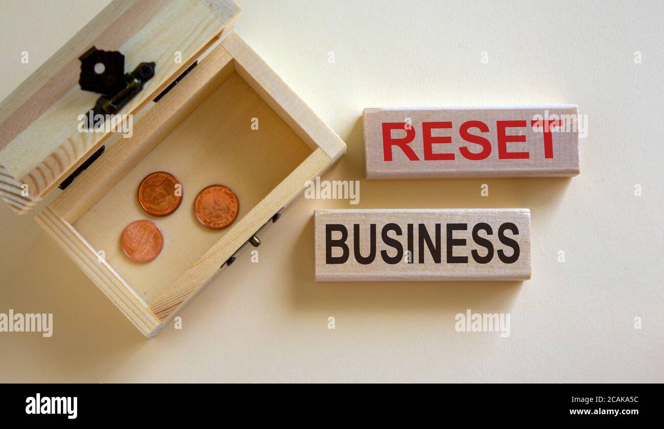Concept words 'reset business' on blocks on a beautiful white ...