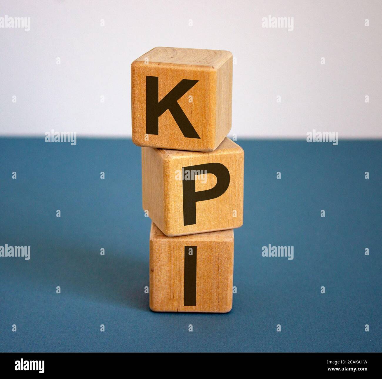 Concept word KPI on cubes on a beautiful blue background Stock Photo ...