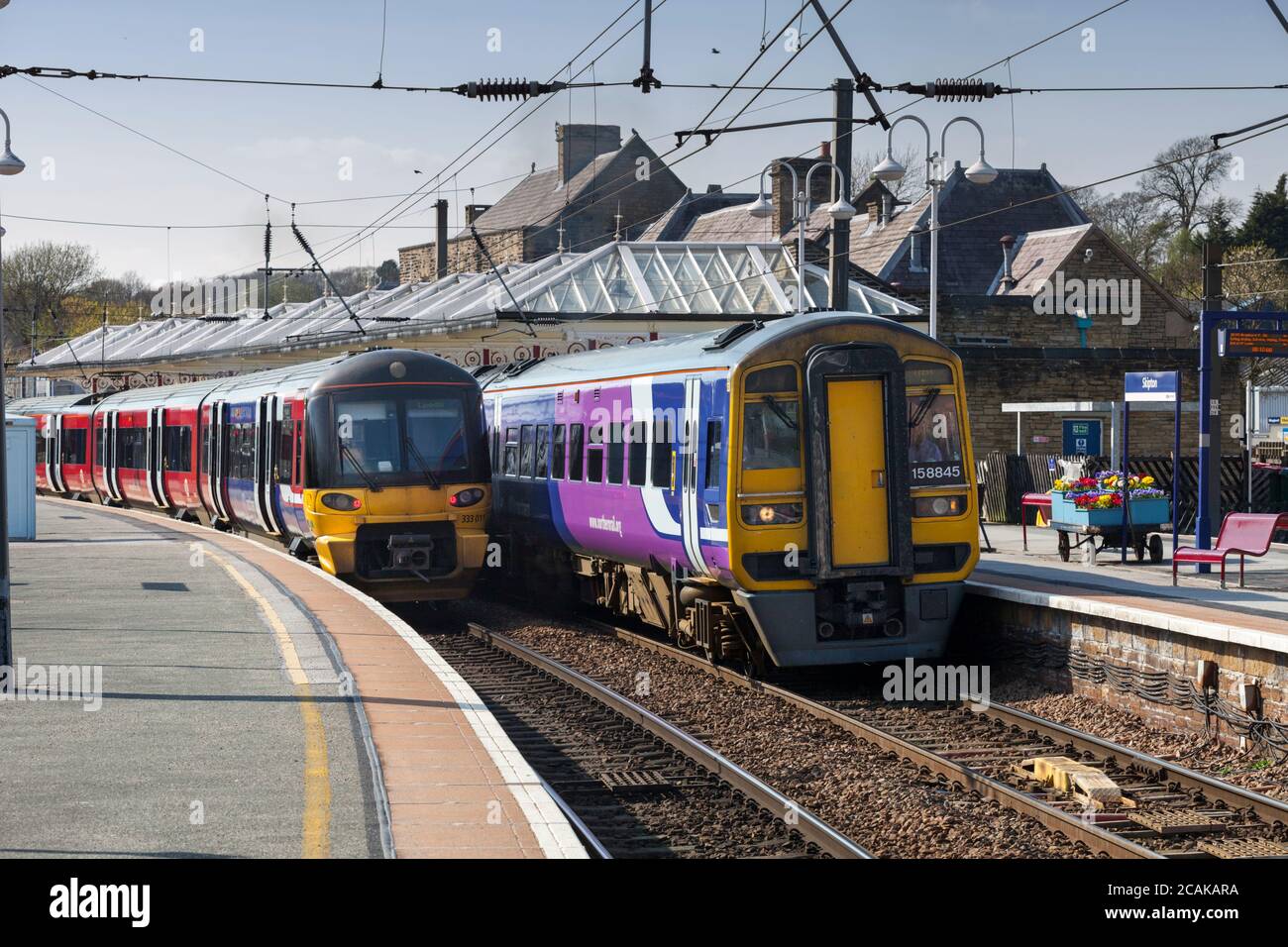 Northern Rail Siemens / CAF class 333 electric train (left) and BREL ...
