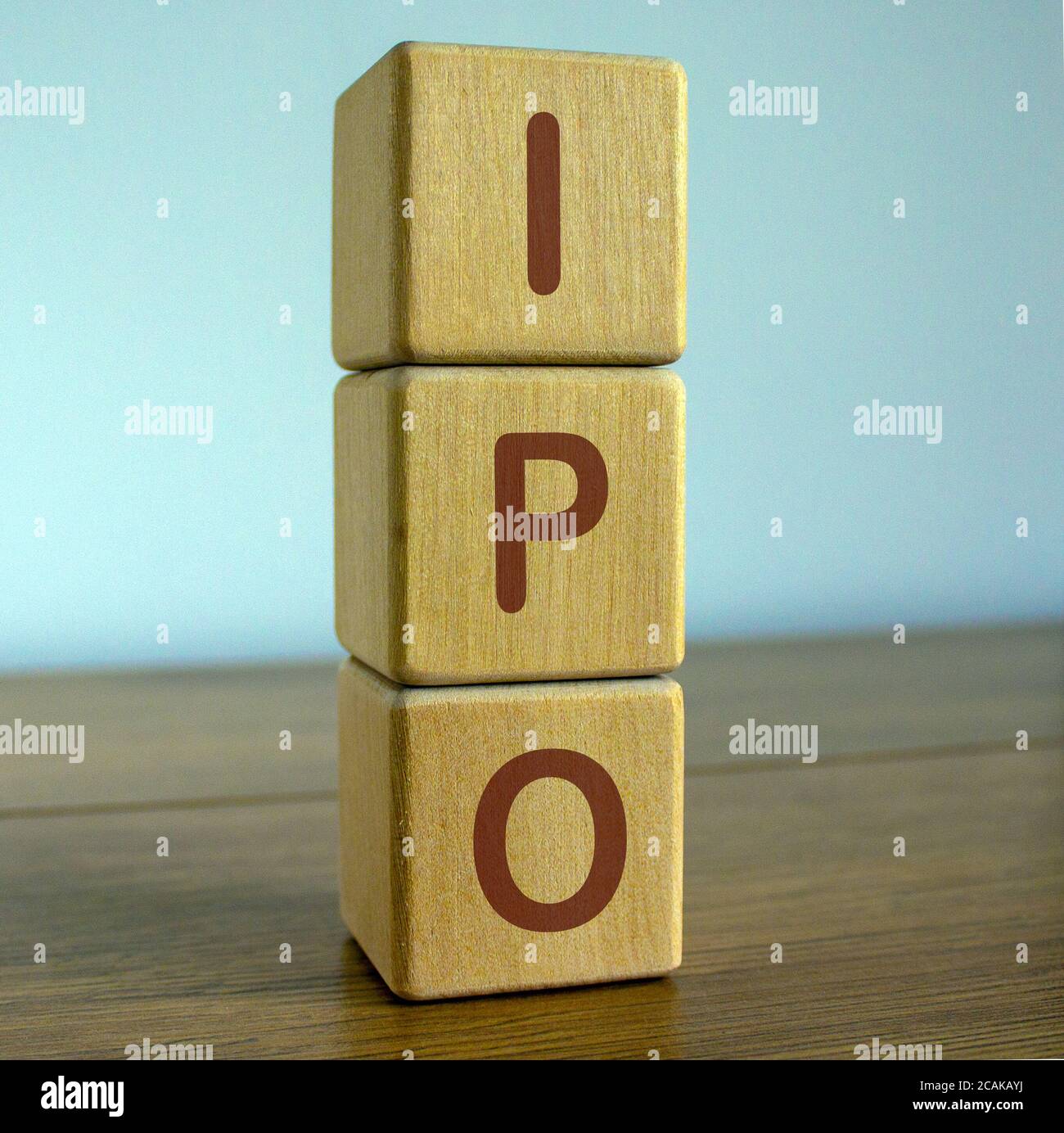 concept word IPO on cubes on a beautiful blue background Stock Photo ...
