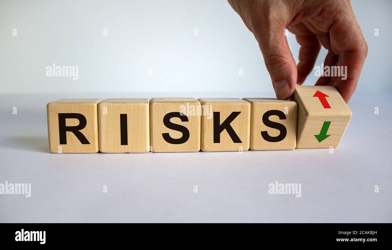 Hand is turning a cube and changes the direction of an arrow ...