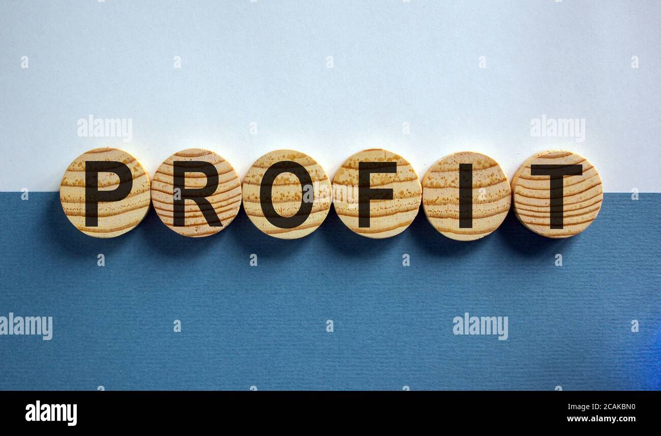 Wood circles with word 'profit' on paper blue and white background ...