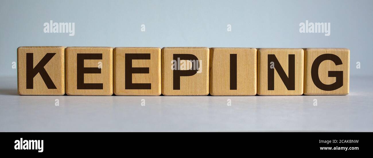 Concept word 'keeping' on cubes on a beautiful white background Stock ...