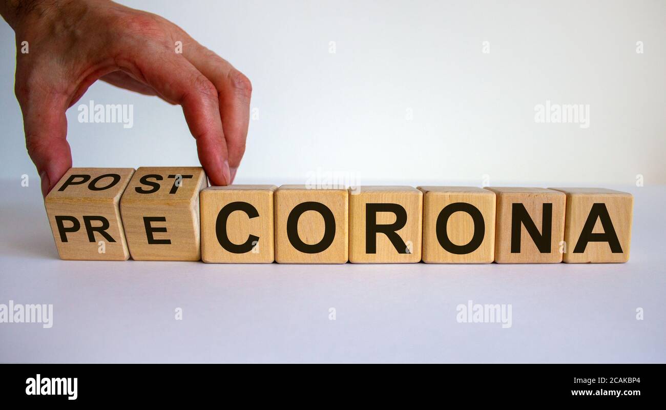 Hand turns cubes and changes the expression 'pre corona' to 'post ...
