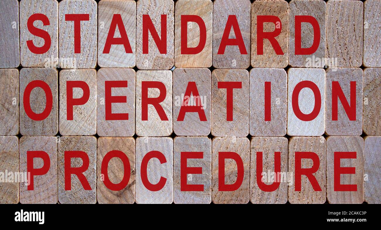 Wooden blocks form the words 'standard, operation, procedure ...