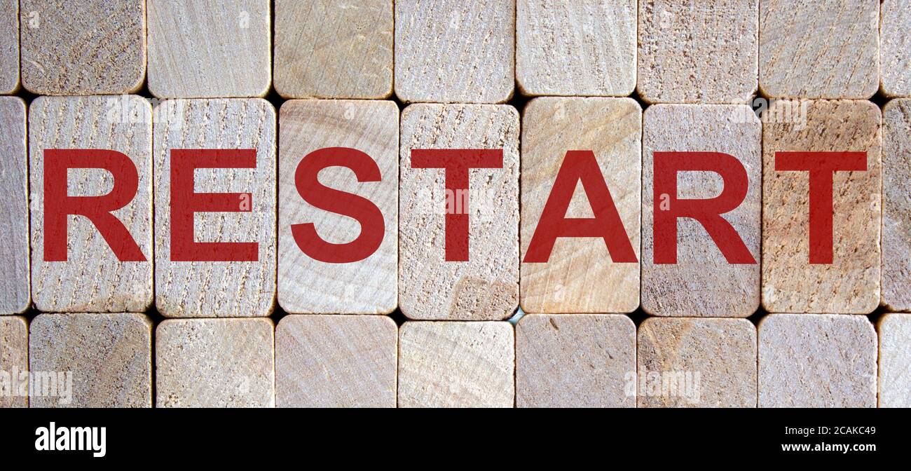 Wooden blocks form the word 'restart'. Beautiful wooden background ...