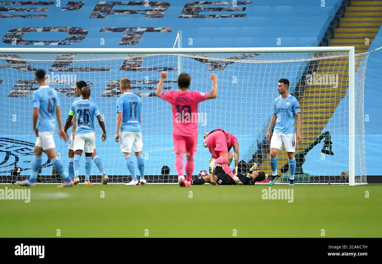 Real Madrid's Karim Benzema (centre hidden) celebrates scoring his side ...