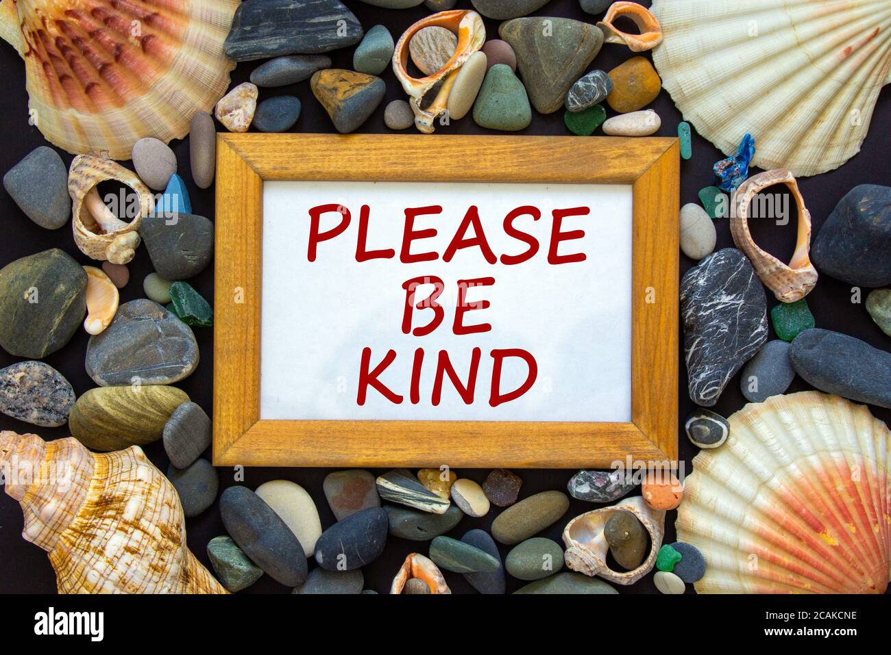 Wooden picture frame with inscription 'please be kind' on beautiful ...