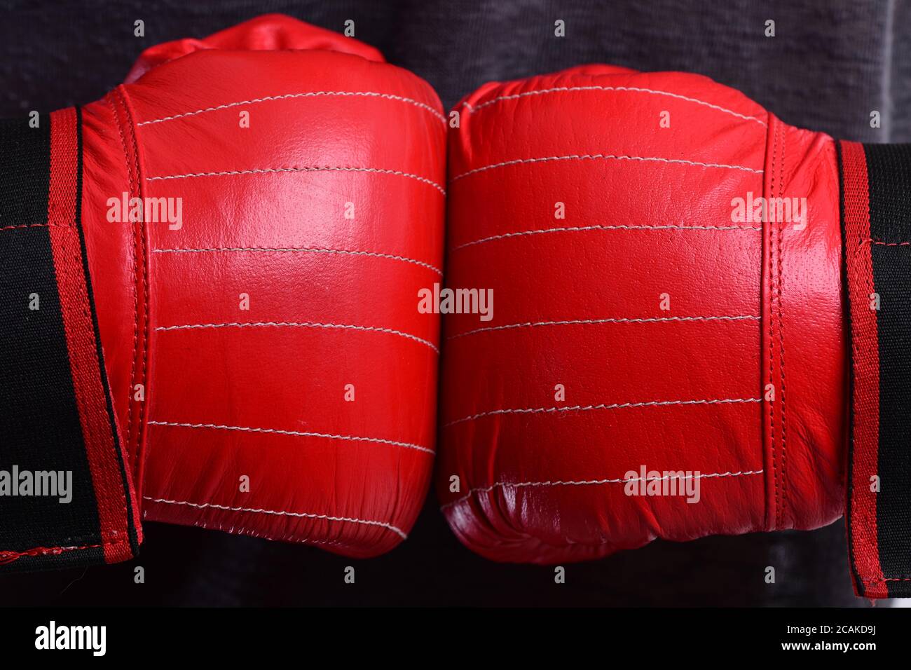 Boxer presses hands together. Athletes hands in leather gloves for box ...