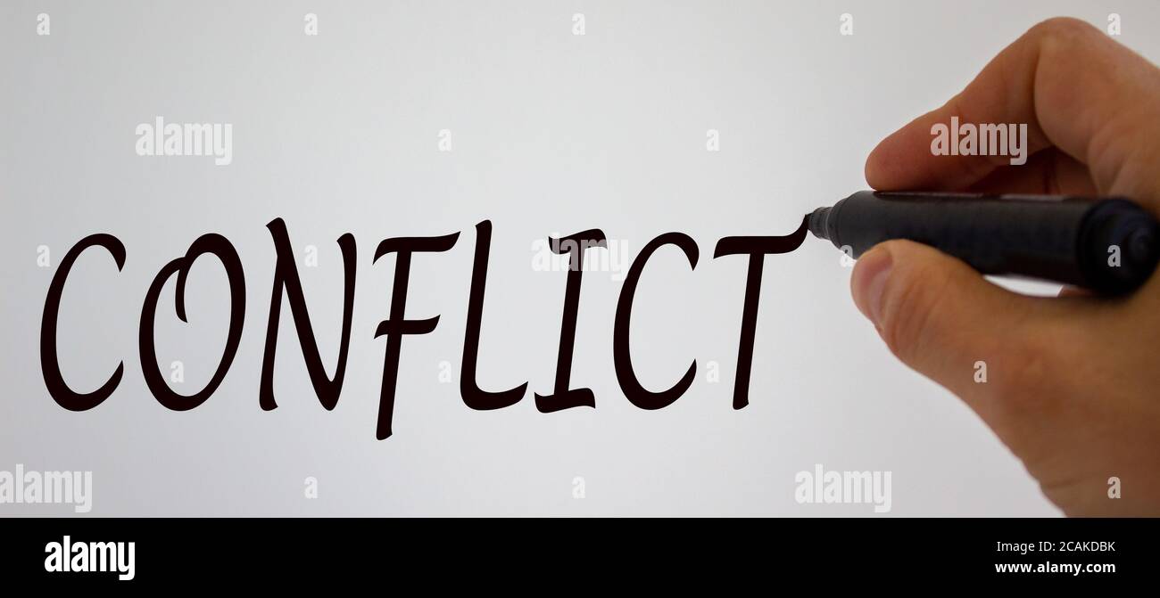 Hand writing 'conflict', isolated on white background Stock Photo - Alamy
