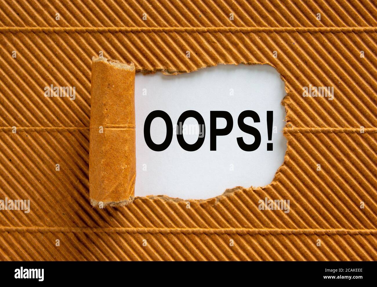 The word 'oops' appearing behind torn brown paper. Beautiful background ...