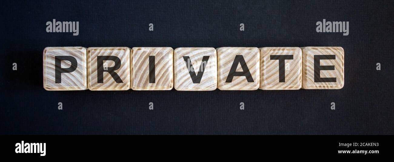 concept word private on cubes on a beautiful dark background Stock ...