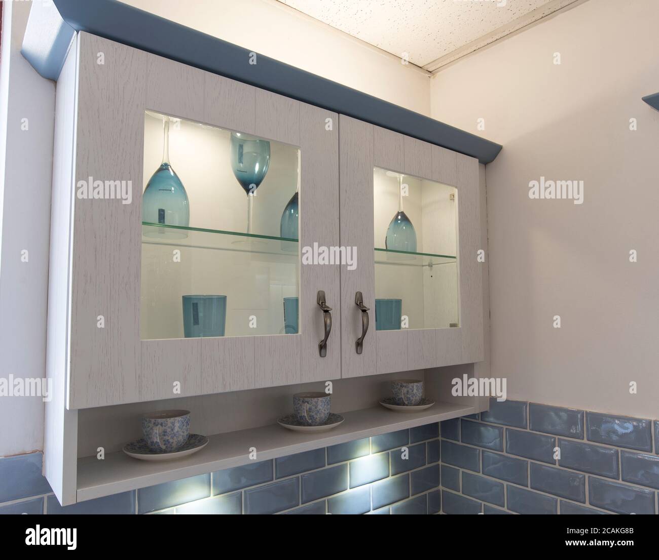 Modern kitchen sink and wall cabinets Stock Photo - Alamy