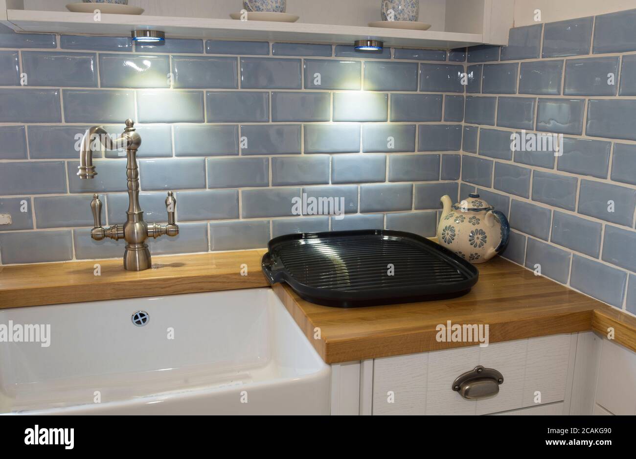 Modern kitchen sink and wall cabinets Stock Photo - Alamy