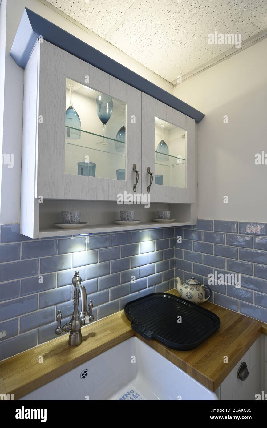 Modern kitchen sink and wall cabinets Stock Photo - Alamy