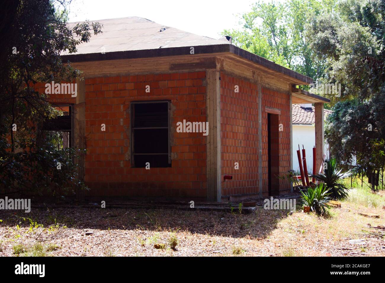 red brick exterior walls under construction of a incomplete residential ...