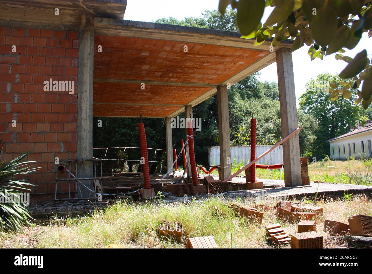 red brick exterior walls under construction of a incomplete residential ...