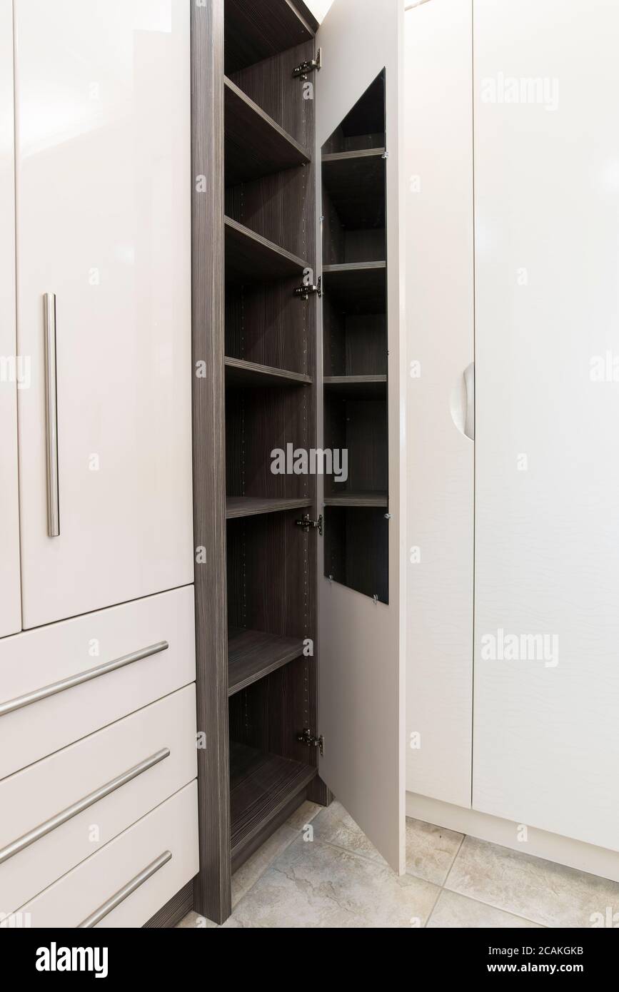 Tall modern bedroom wardrobe example Stock Photo - Alamy