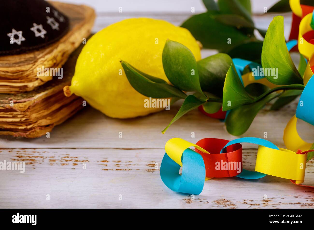 Symbols traditional Jewish religious festival over paper colorful chain ...