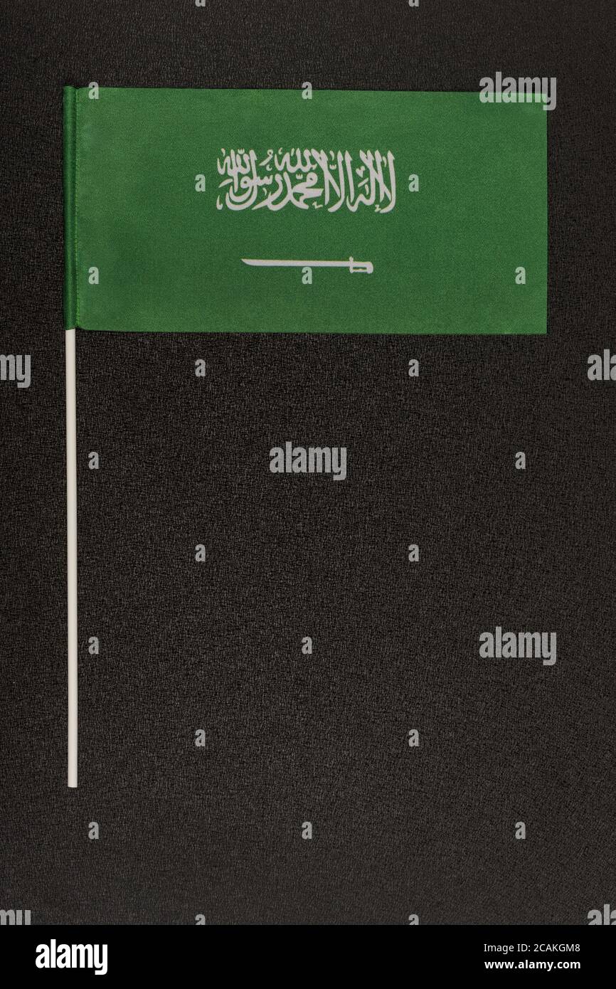 desktop flag of Kingdom of Saudi Arabia on black background. Green flag ...