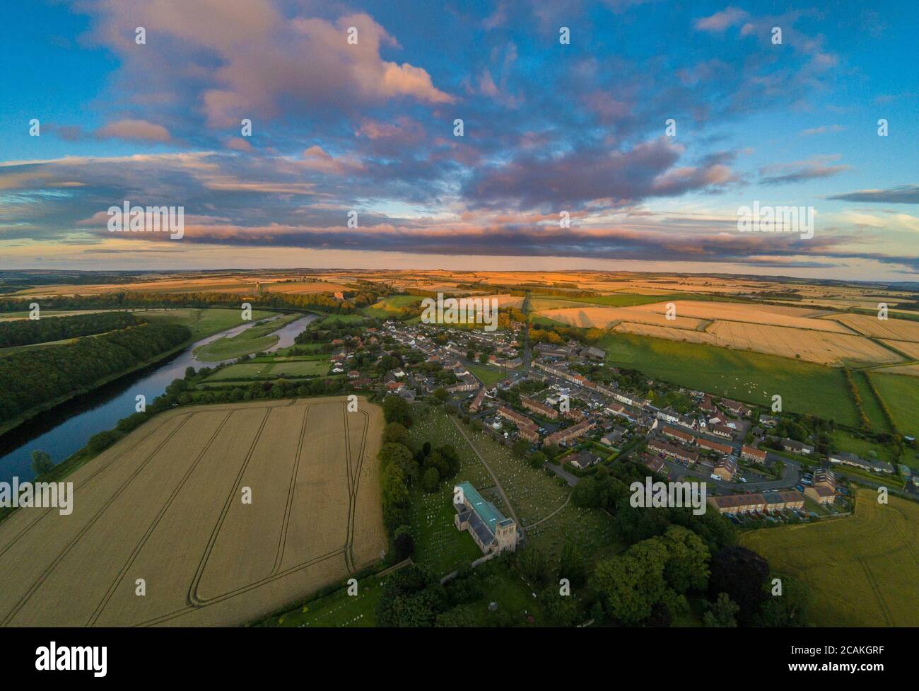 Norham village with its Norman castle and church next to the River ...