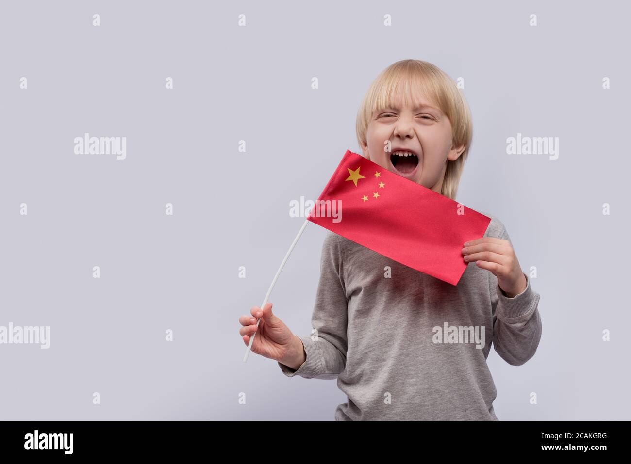 Child holding chinese national flag hi-res stock photography and images ...