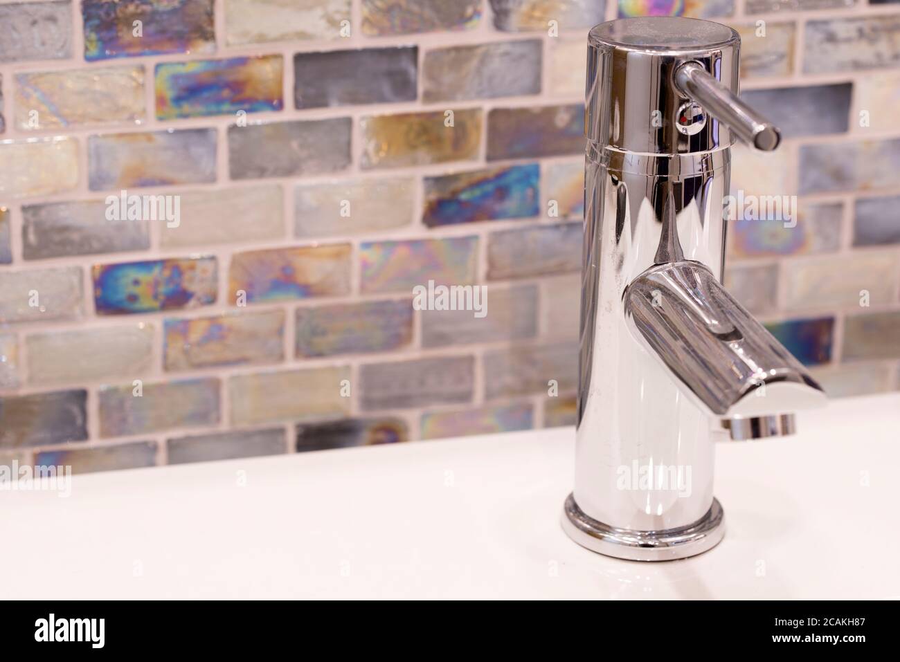 New chrome bathroom tap example Stock Photo - Alamy