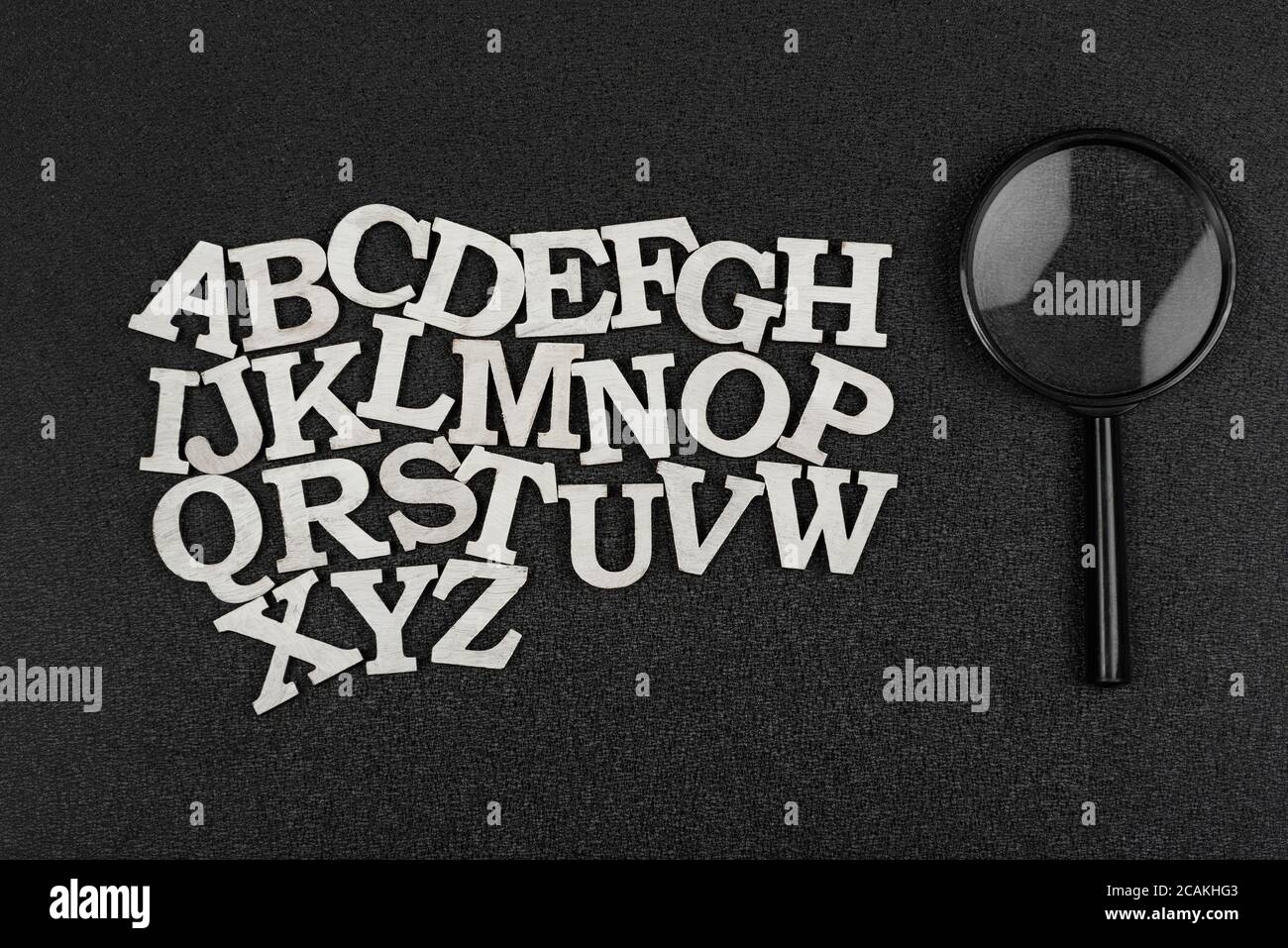 Latin letters in alphabetical order from A to Z on black background ...