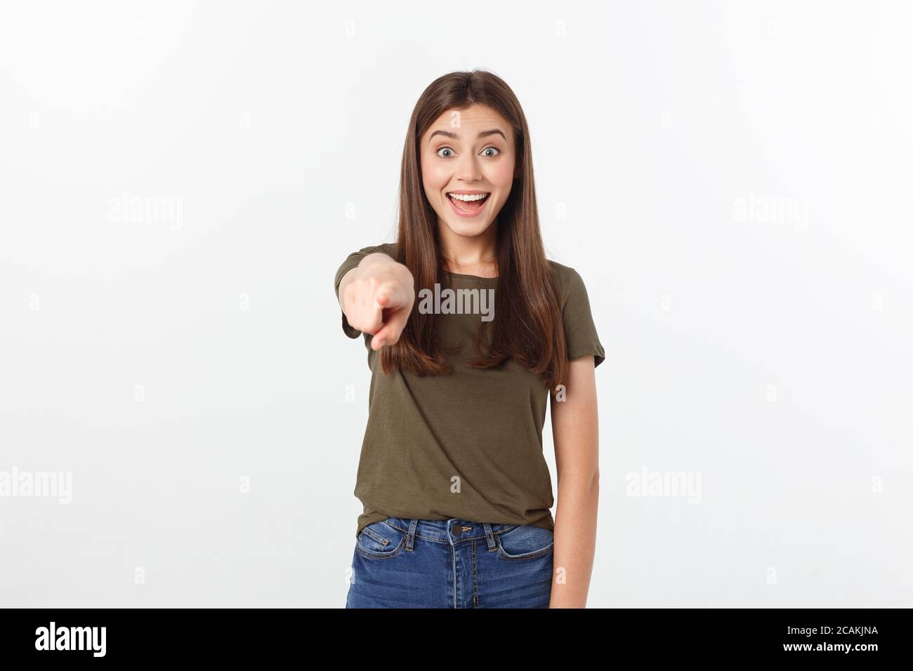 Portrait happy and surprised young lady standing isolated over grey ...