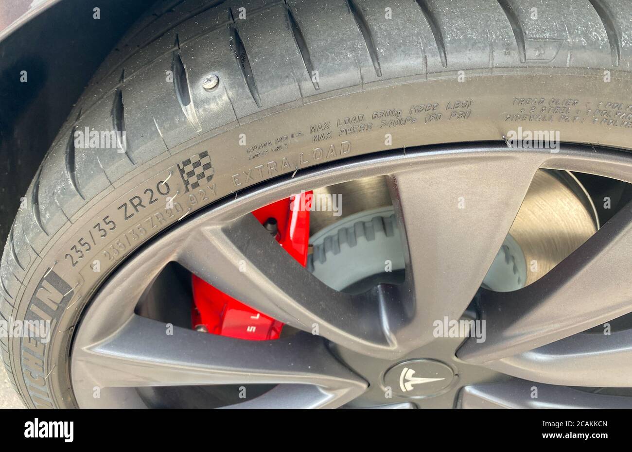 Orlando,FL/USA- 8/2/20: A Tesla with a Michelin tire that has a nail in ...