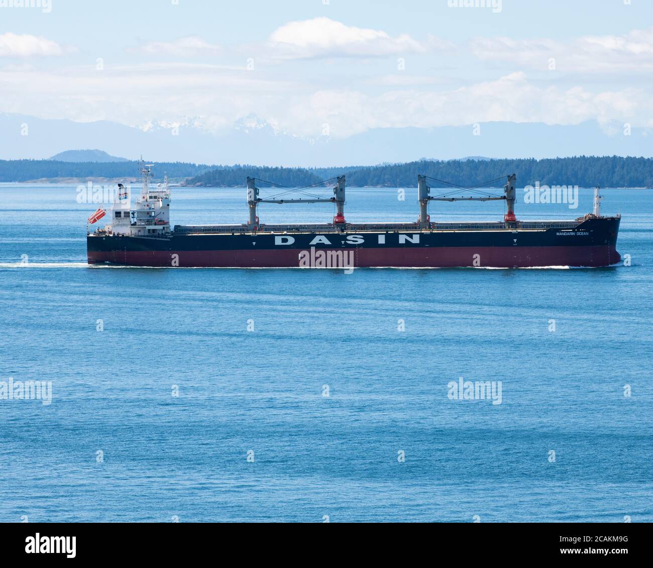 Merchant bulk carriers ply the waters of the Gulf of Georgia, British ...