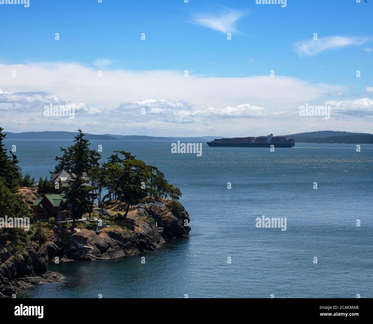 Merchant container ships ply the waters of the Gulf of Georgia, British ...