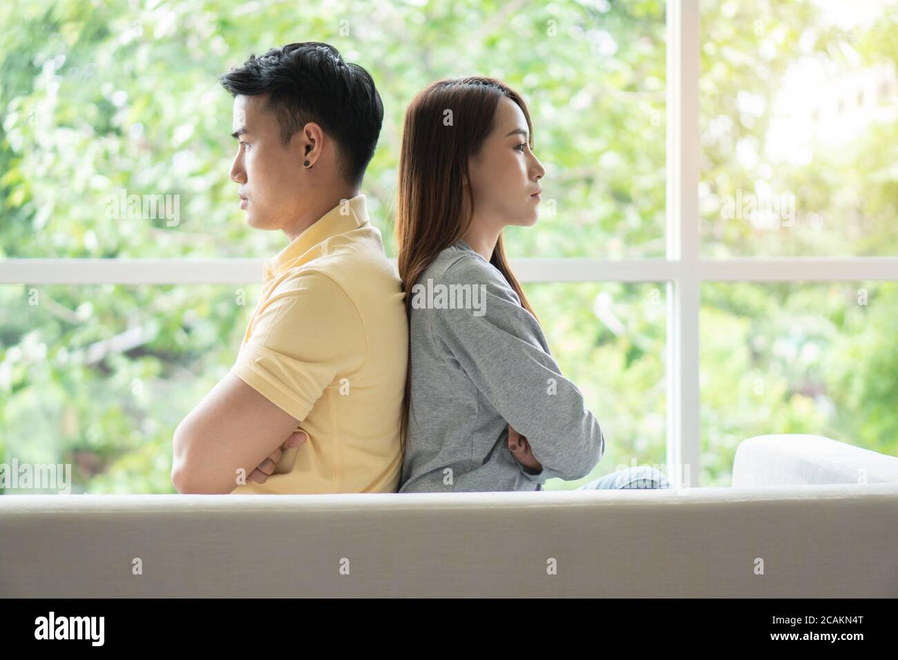 Angry couple arguing behind sad hi-res stock photography and images - Alamy
