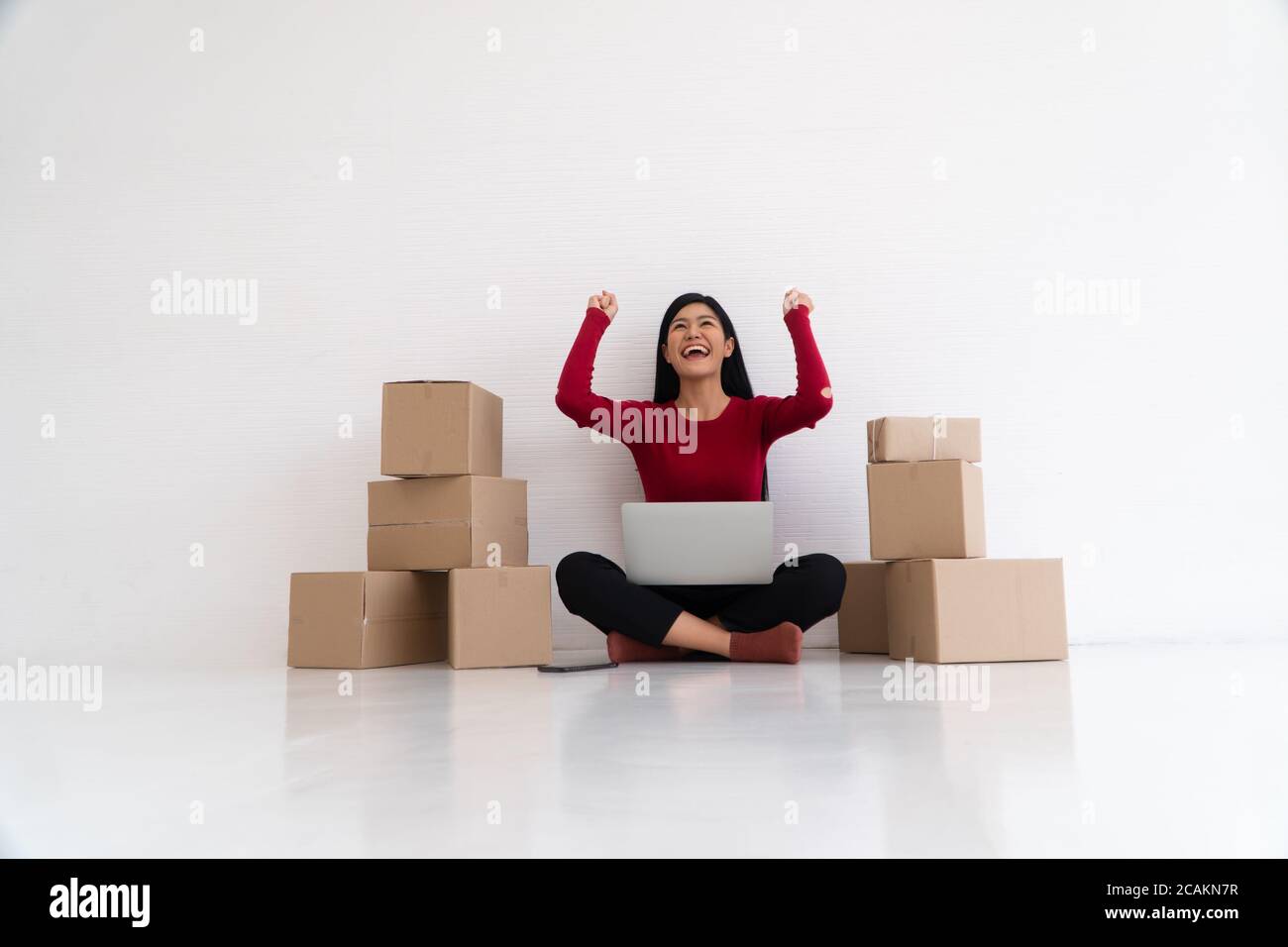 Happy Asian young entrepreneur, Smile for sales success and pointing ...