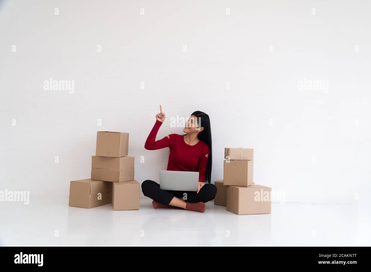 Happy Asian young entrepreneur, Smile for sales success and pointing ...