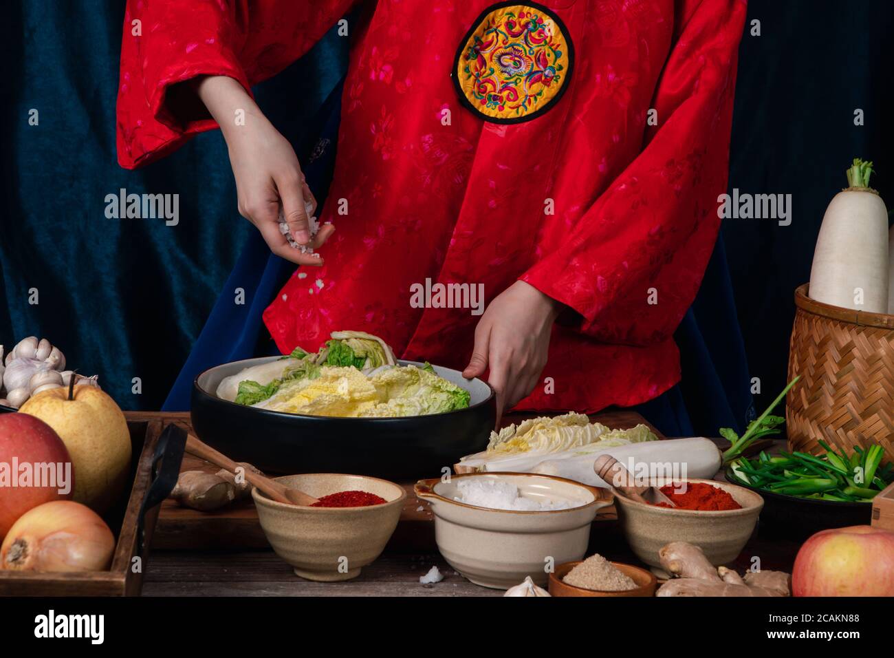 Asian women wearing Korean traditional costumes (hanbok) are Sprinkling ...