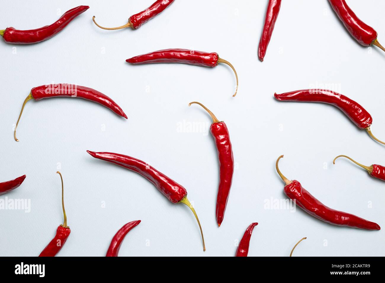Red hot chilli peppers on blue background. flat lay, top view Stock ...