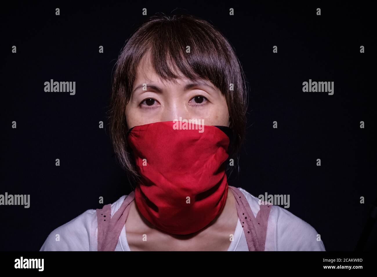 Japanese girl in a mask Stock Photo - Alamy