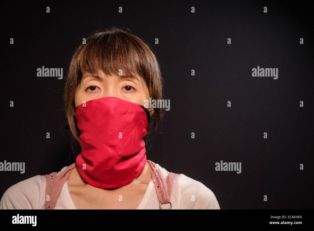 Japanese girl in a mask Stock Photo - Alamy