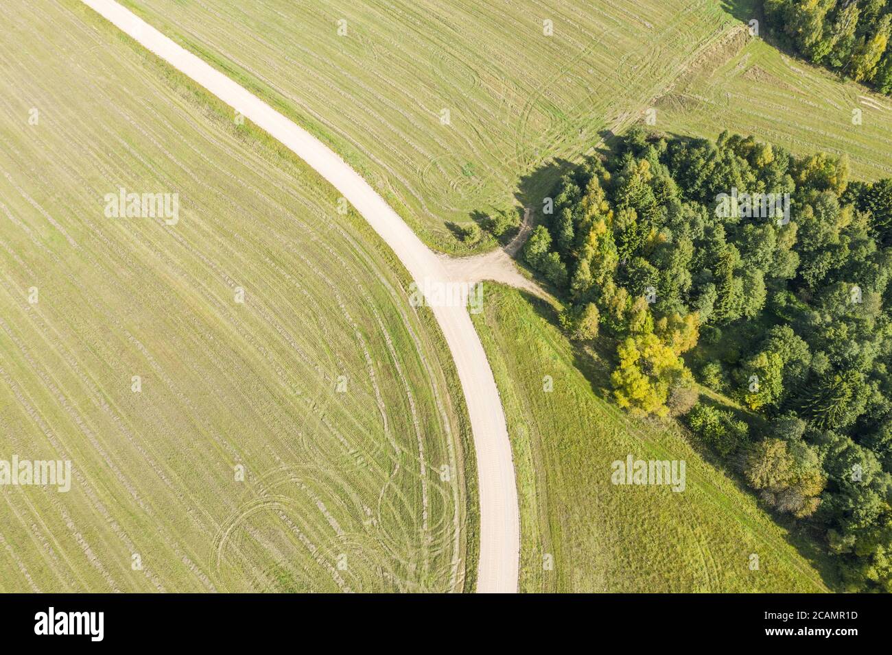 Aerial view of road through agricultural fields and forest hi-res stock ...