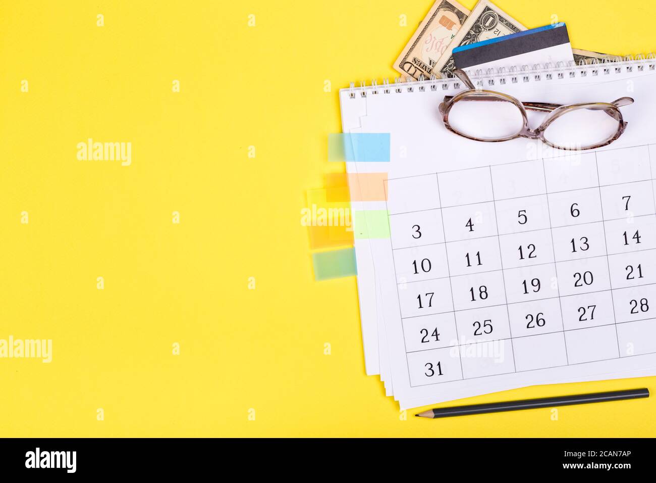 White clean calendar on solid yellow background with copy space ...
