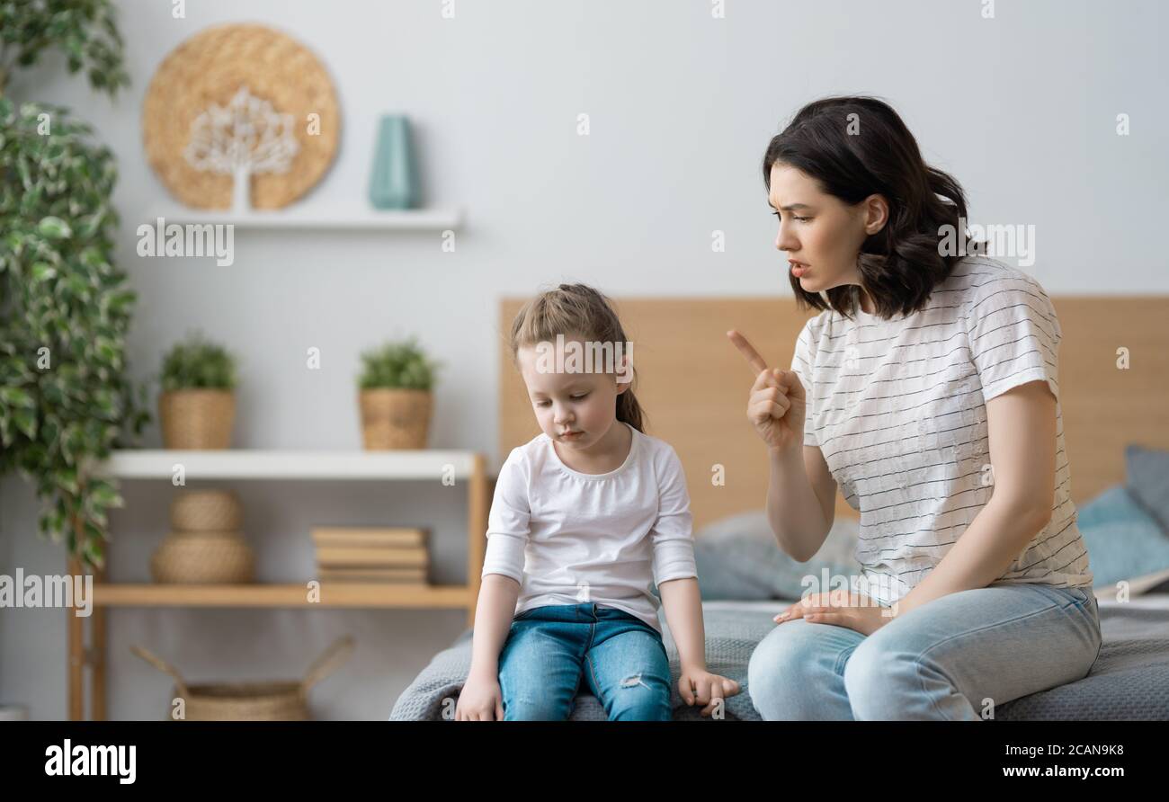 mother is scolding her child girl. family relationships Stock Photo - Alamy