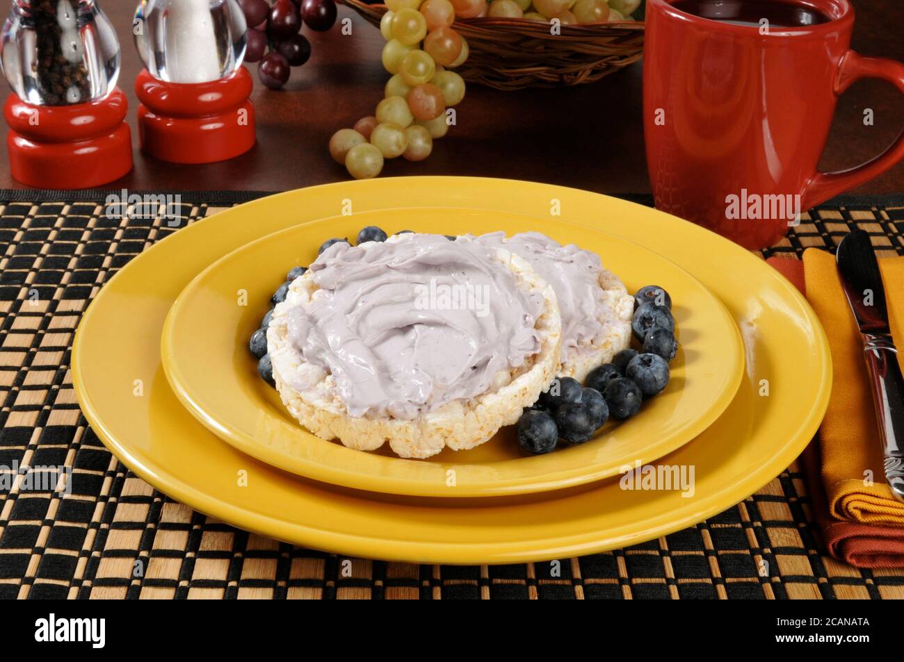Blueberry cream cheese and fresh blueberries on rice cakes with coffee ...
