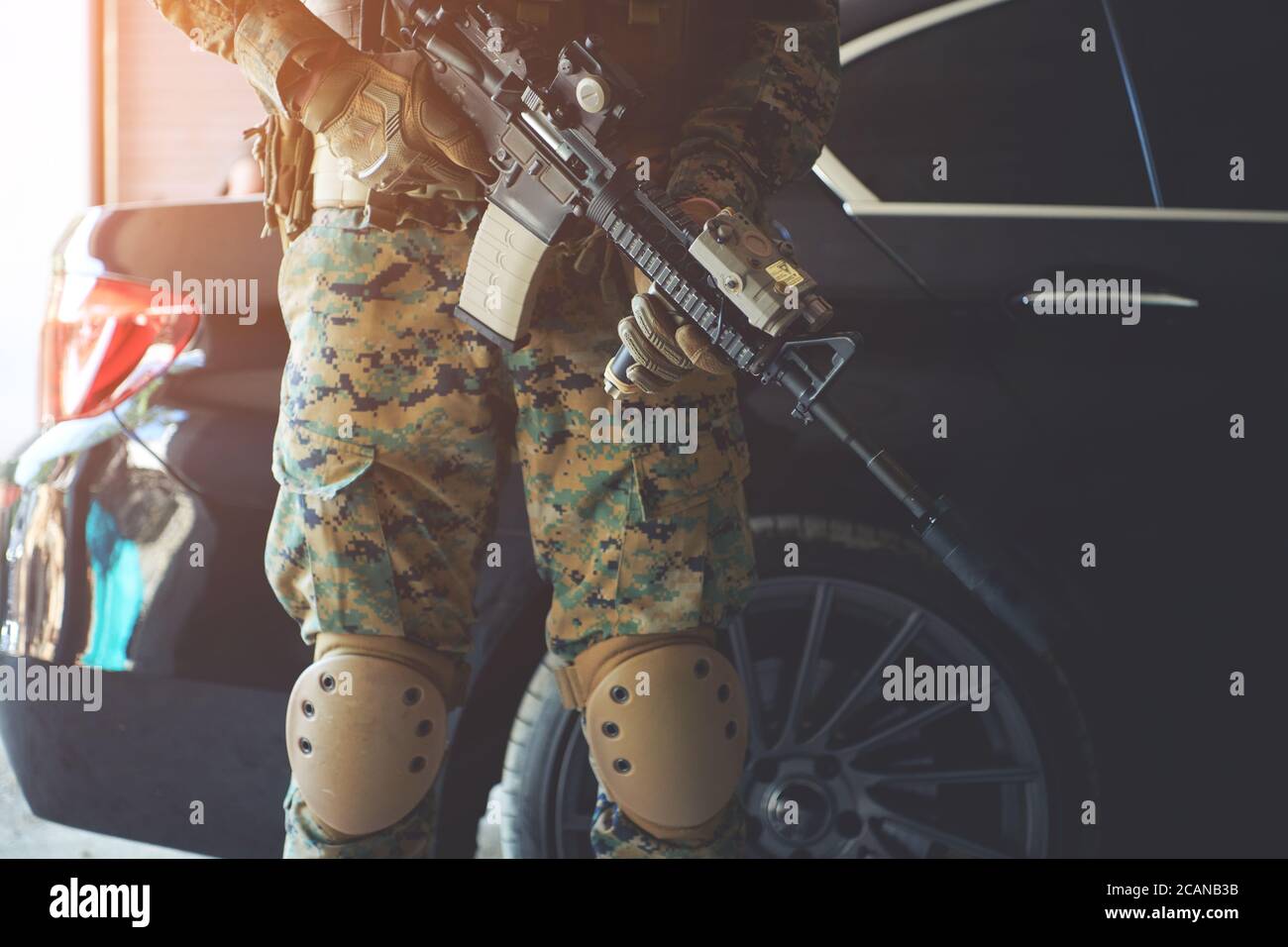 soldier protecting armored luxury vehicle a security guard in military ...